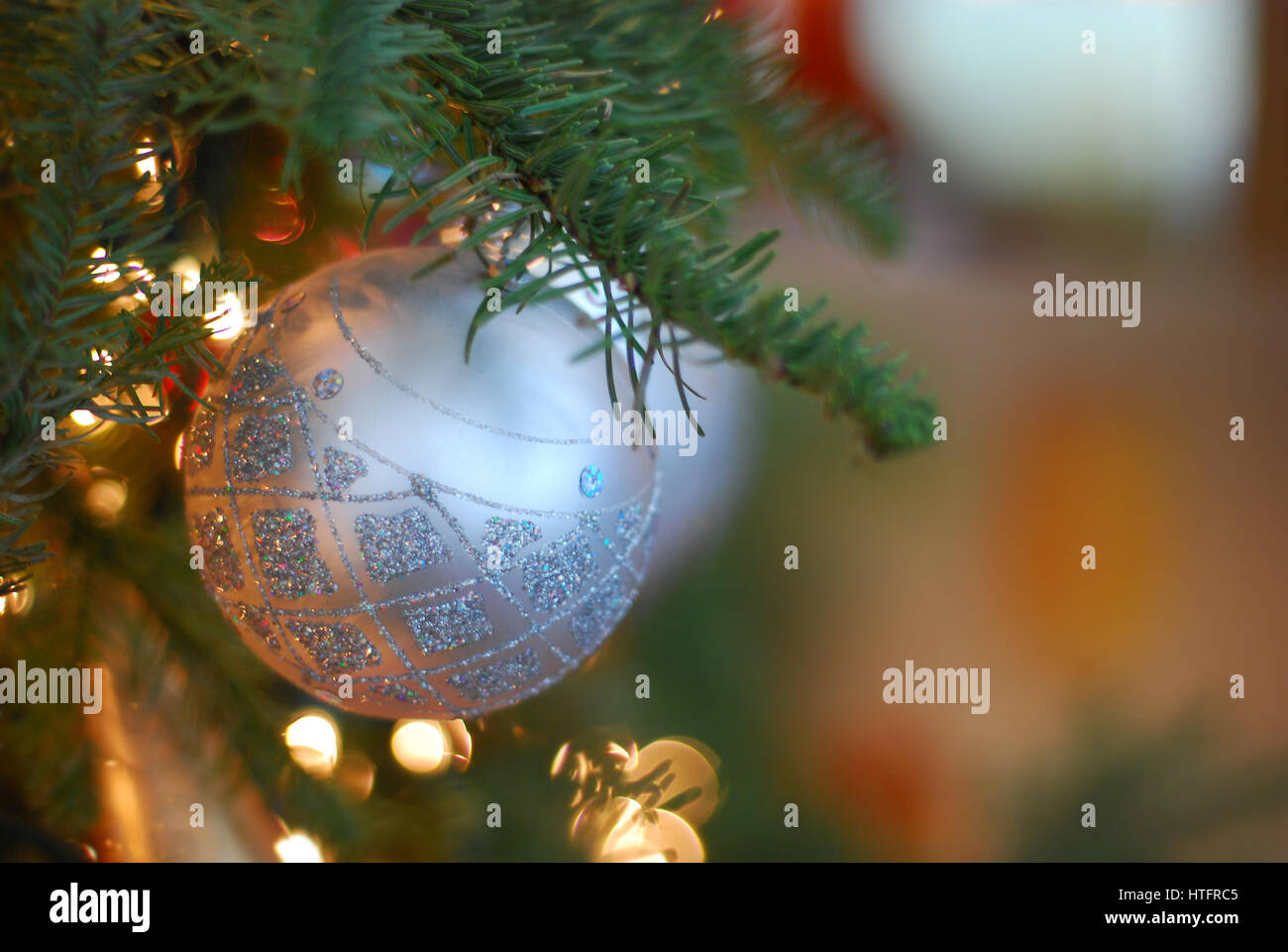 Ornament hanging on real Christmas tree Stock Photo - Alamy
