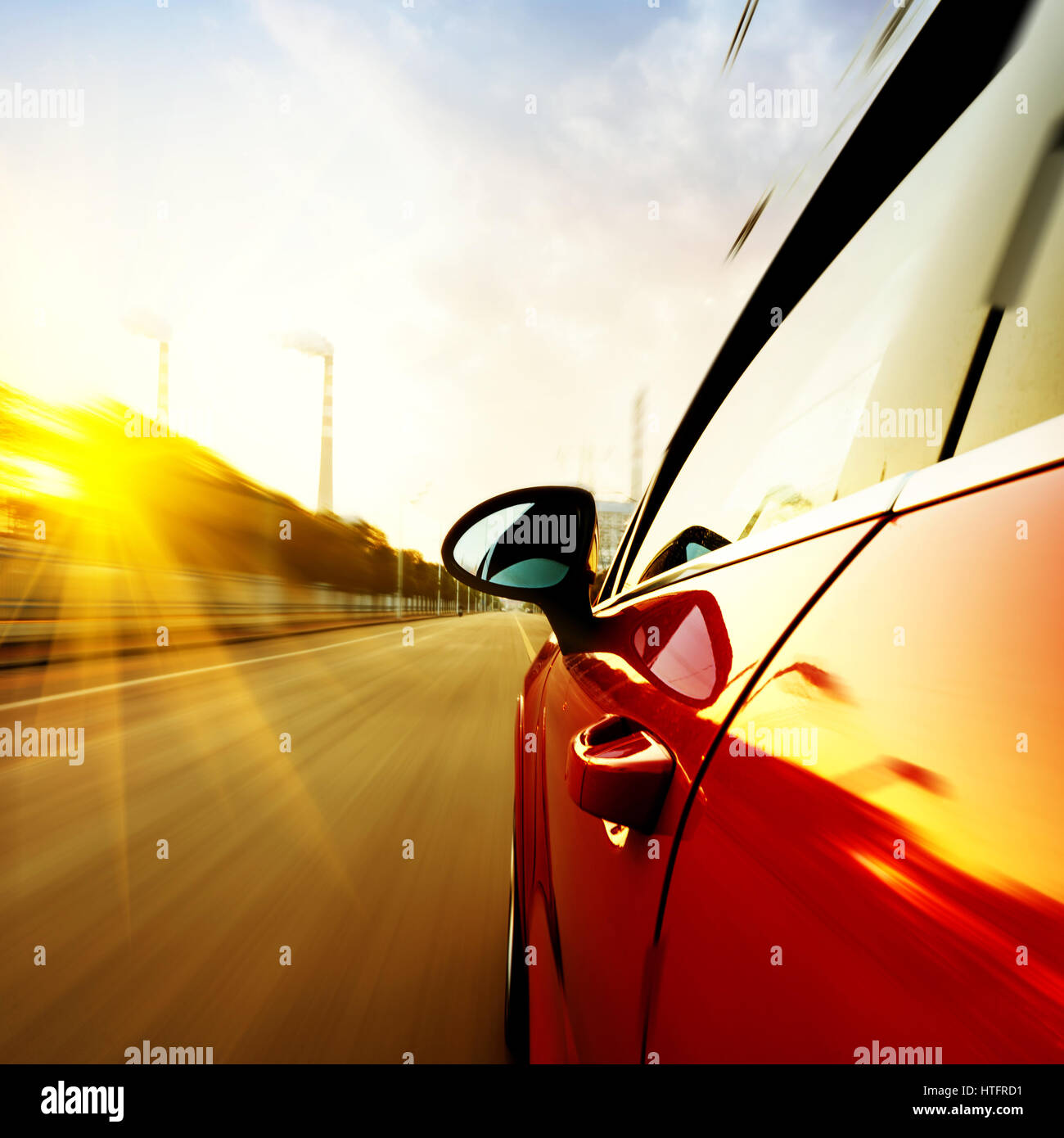 A car driving on a motorway at high speeds, overtaking other cars Stock ...