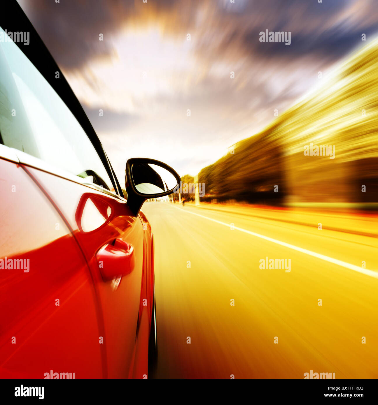 A car driving on a motorway at high speeds, overtaking other cars Stock ...