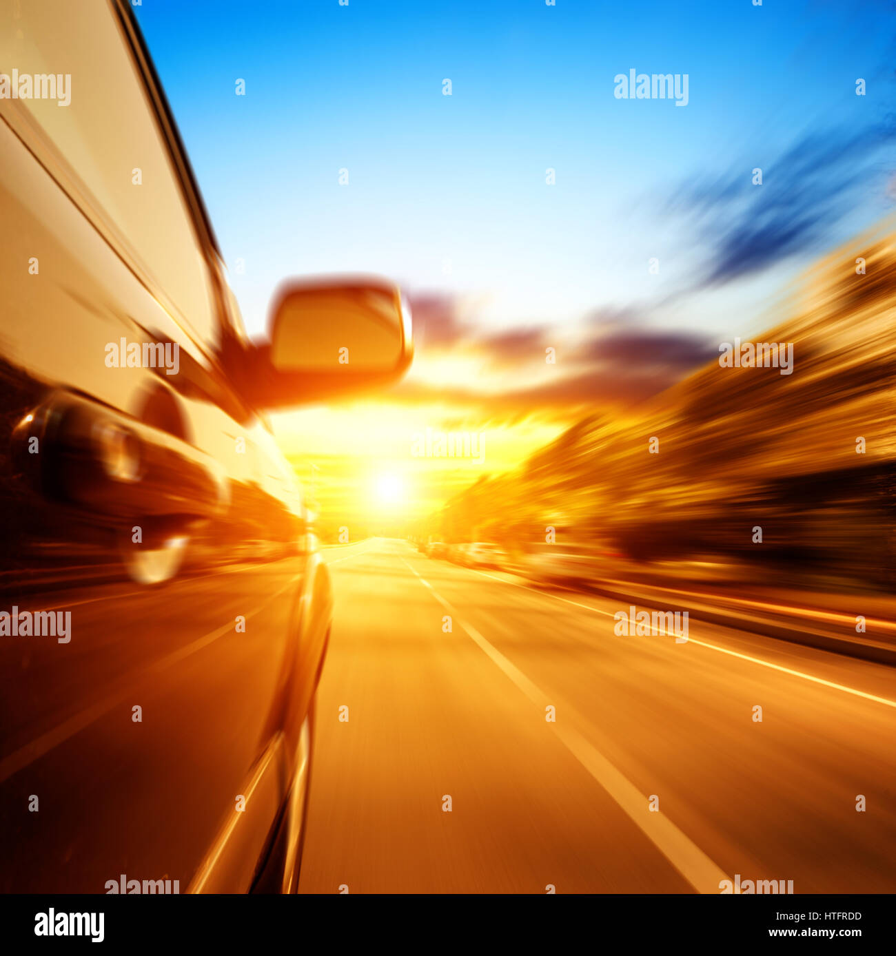 A car driving on a motorway at high speeds, overtaking other cars Stock ...