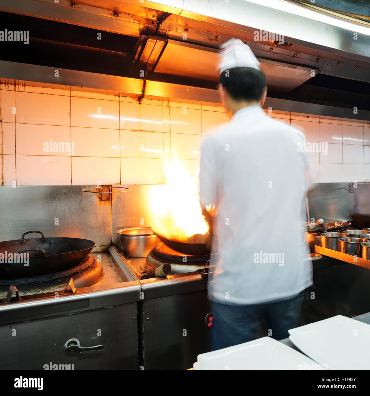 Crowded kitchen, a narrow aisle, working chef Stock Photo - Alamy