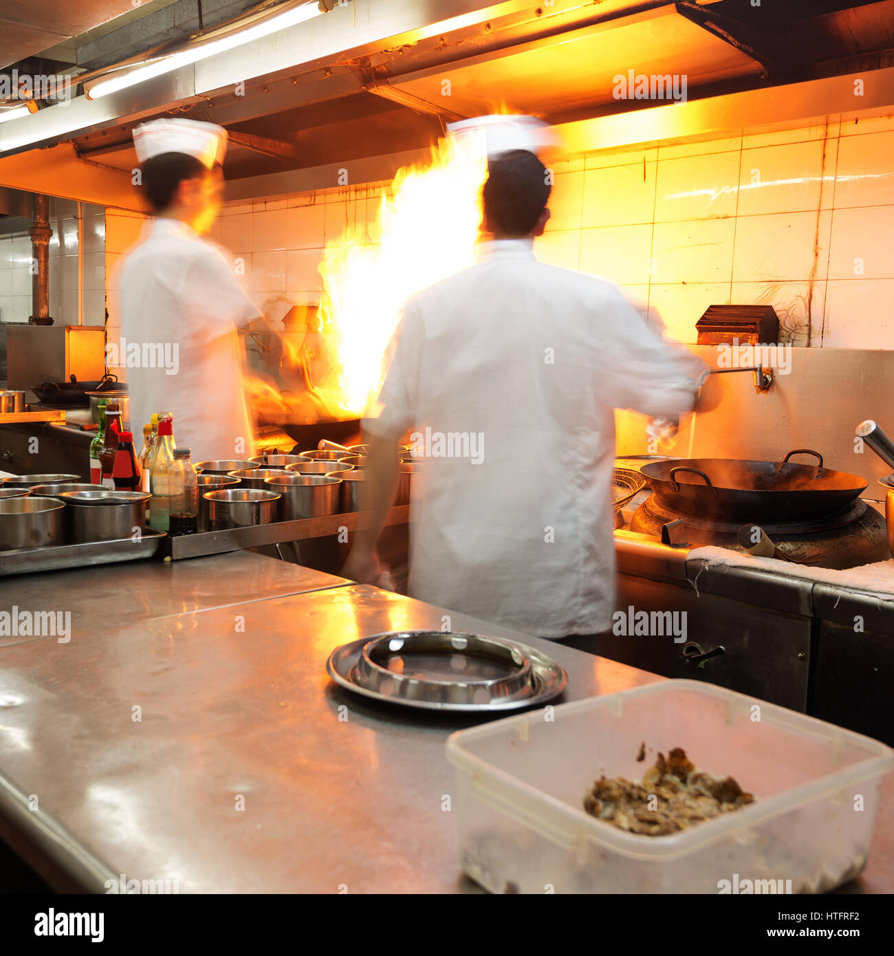 Crowded kitchen, a narrow aisle, working chef Stock Photo - Alamy