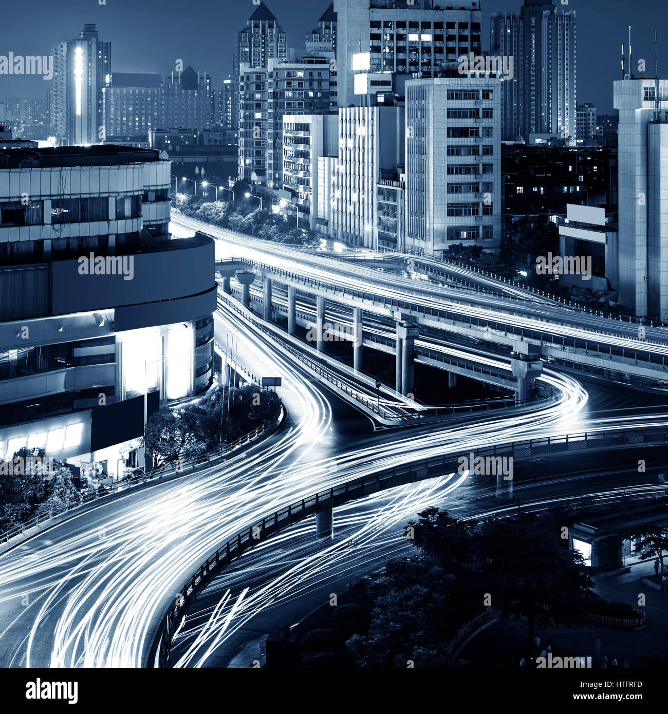 Freeway in night with cars light in modern city Stock Photo - Alamy