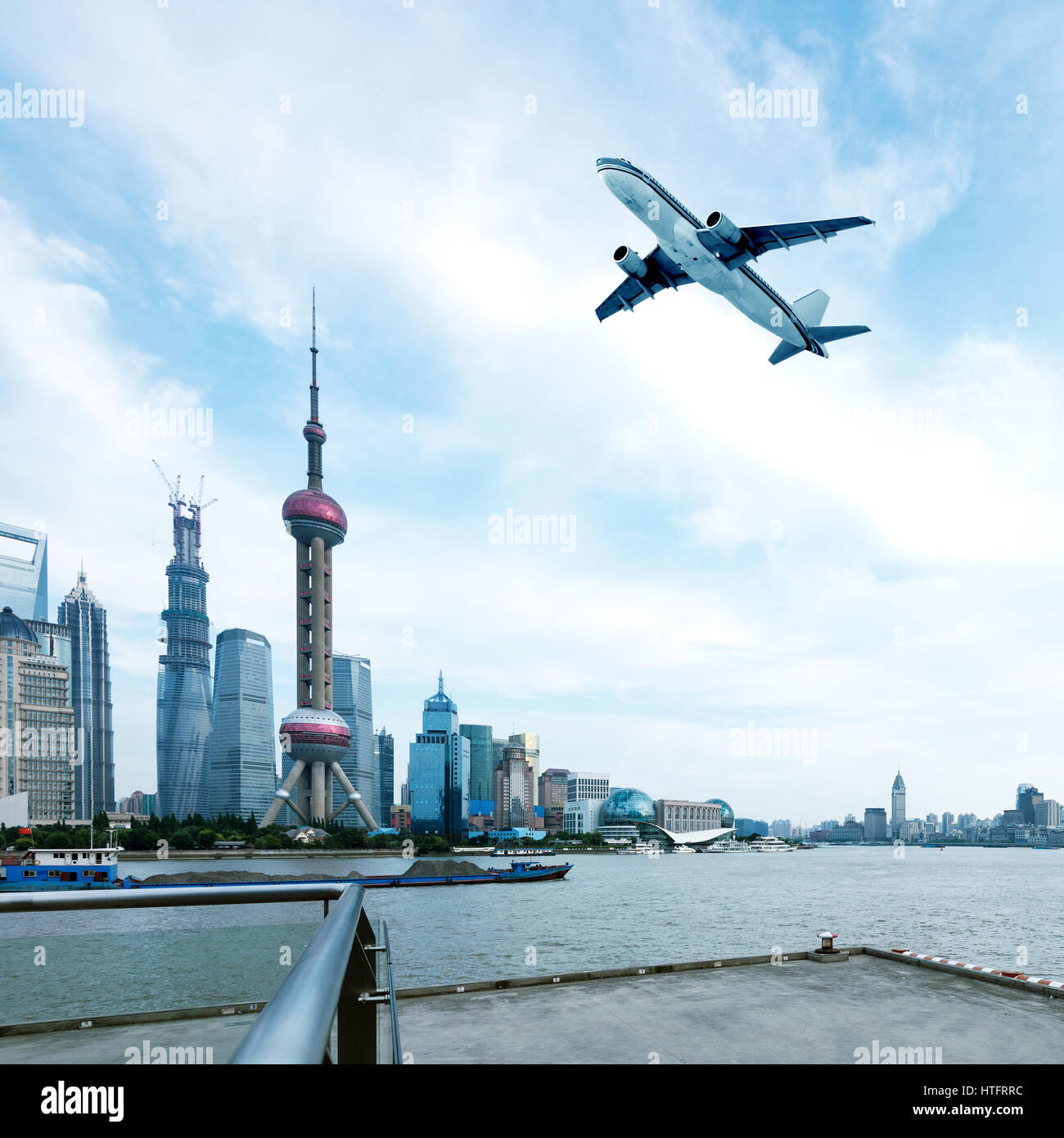 Shanghai's skyscrapers and airplanes on sky Stock Photo - Alamy