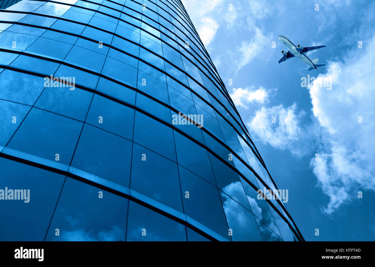 glass curtain wall and aircraft against a blue sky Stock Photo - Alamy