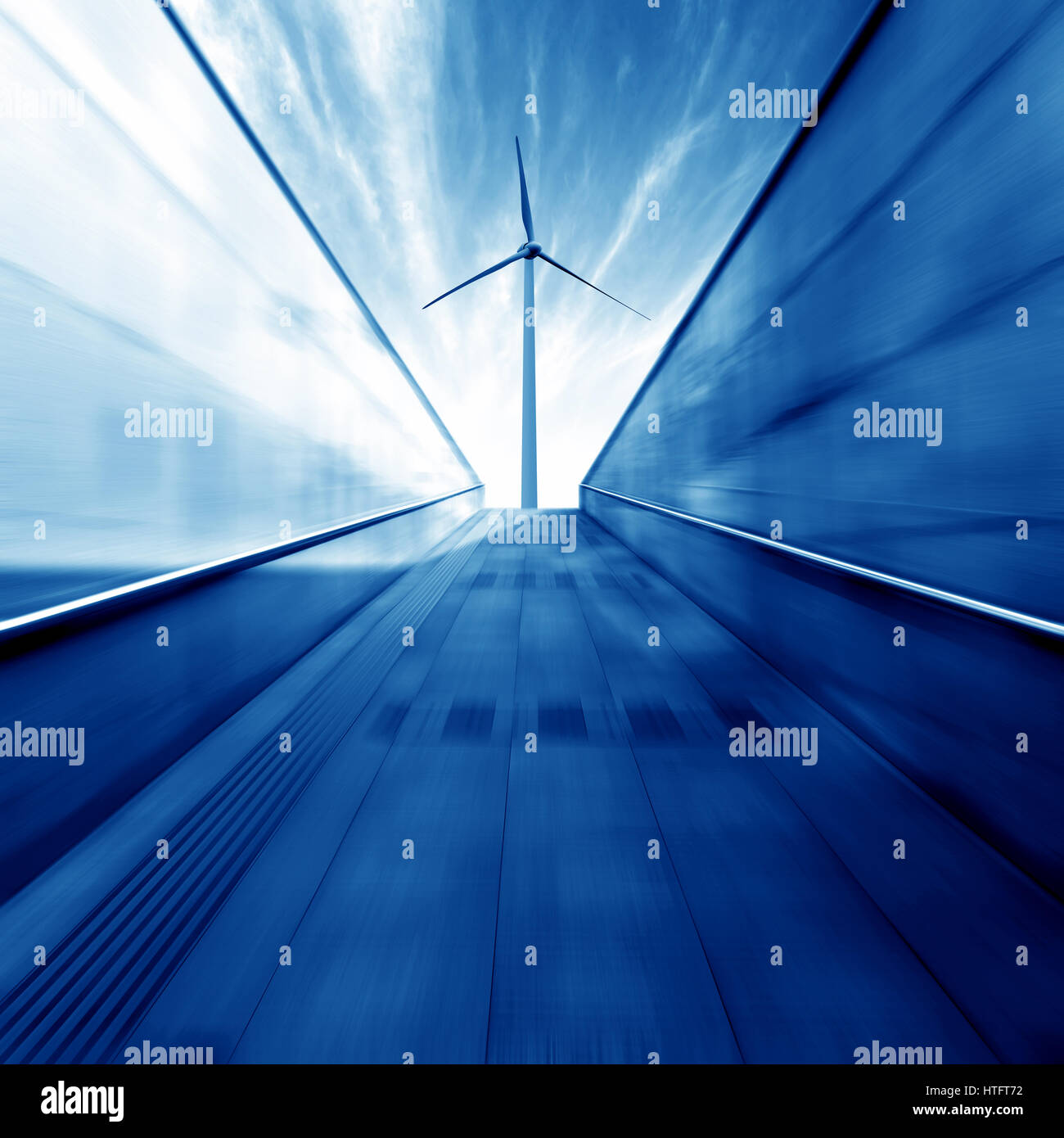 Strong perspective effect tunnel, the distant wind turbines. Urban ...