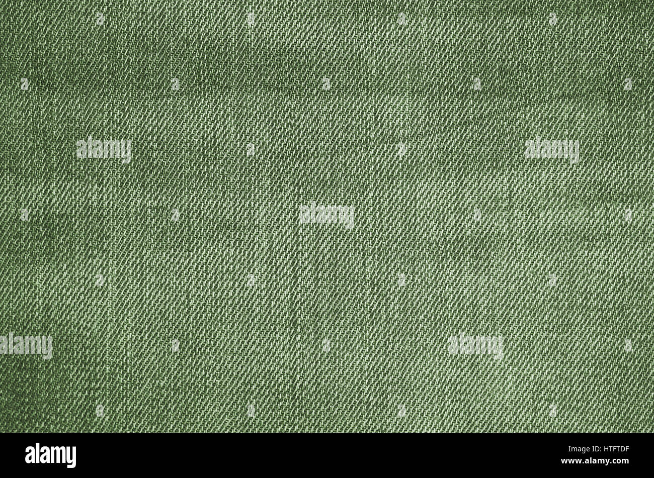 Green texture of jeans textile close up. Blank backdrop for design ...