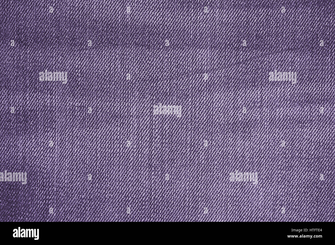 Purple texture of jeans textile close up. Blank backdrop for design ...