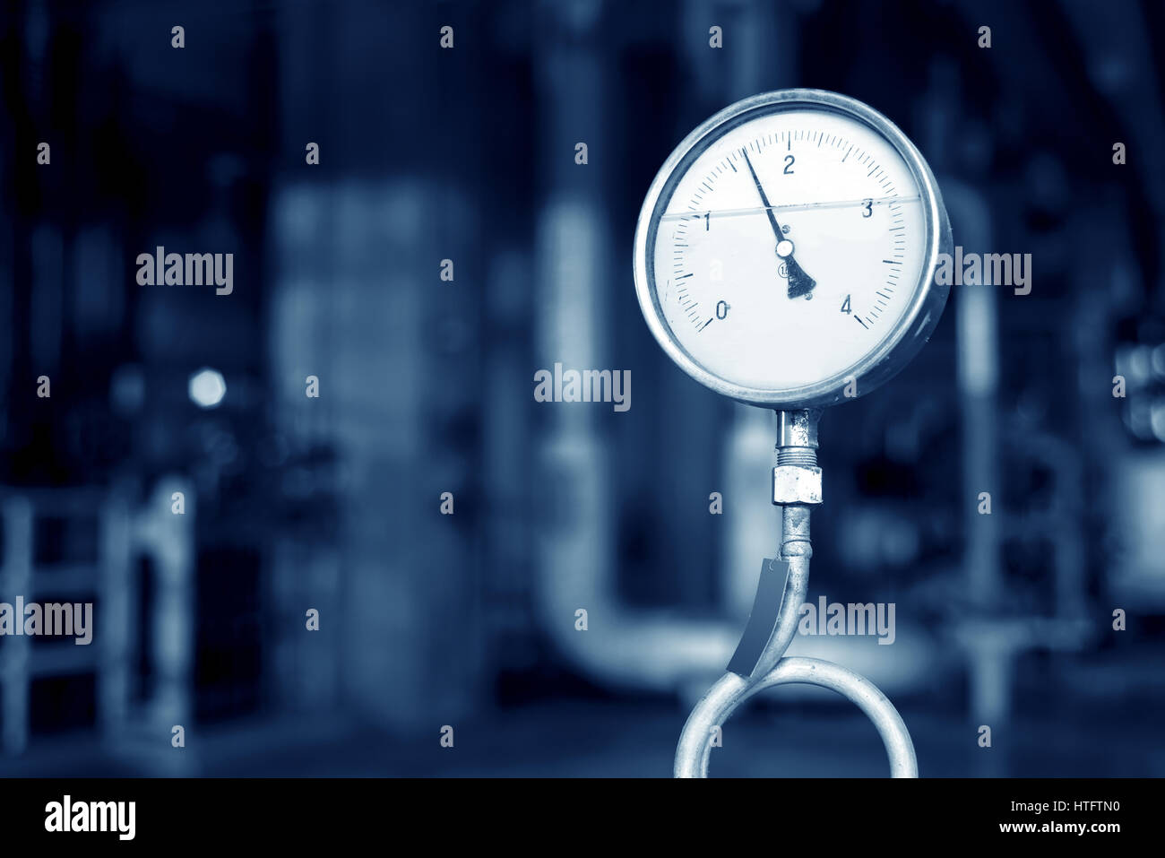 Closeup of manometer, pipes and faucet valves of heating system in a ...