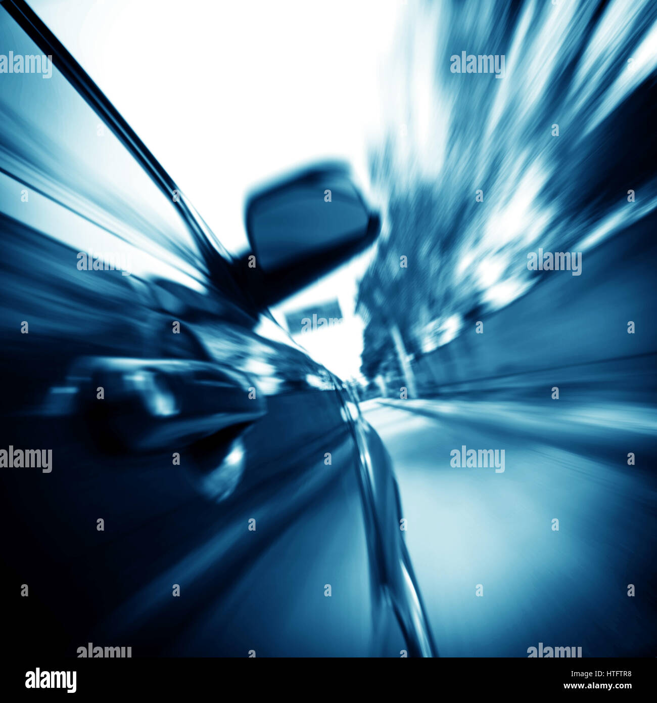 A car driving on a motorway at high speeds, overtaking other cars Stock ...