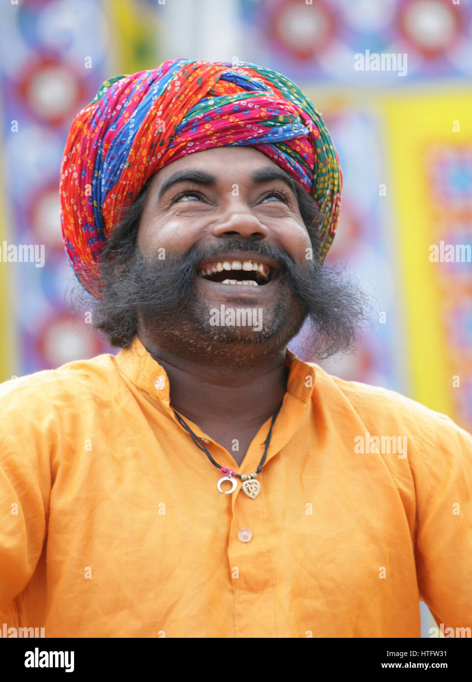 Indian man laughing. Colourful portrait, full frame photograph full of ...