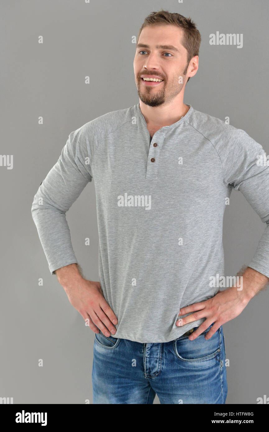 Portrait of a handsome young man on a gray background Stock Photo - Alamy