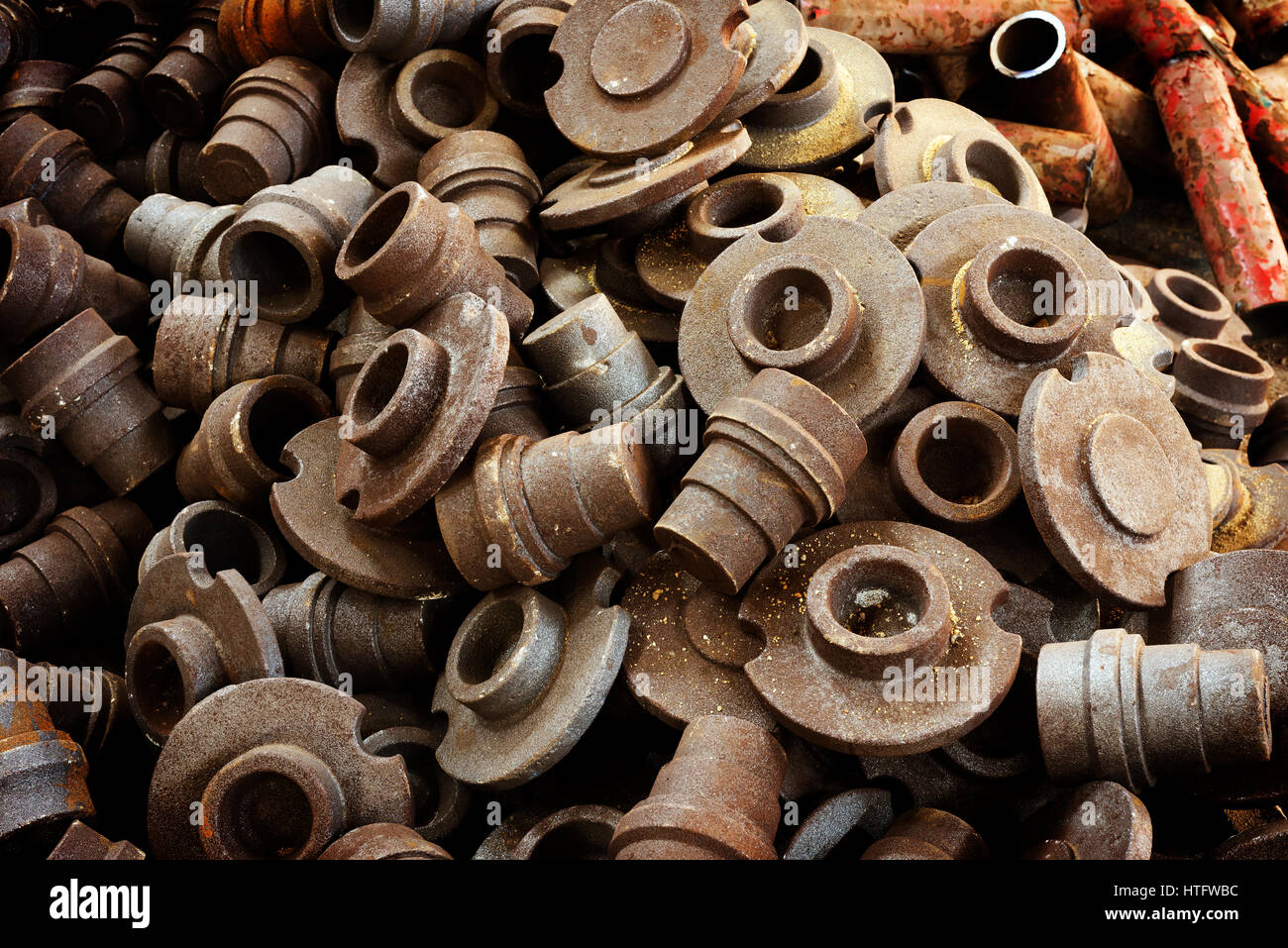 stack of rusted metallic car parts in garage Stock Photo - Alamy