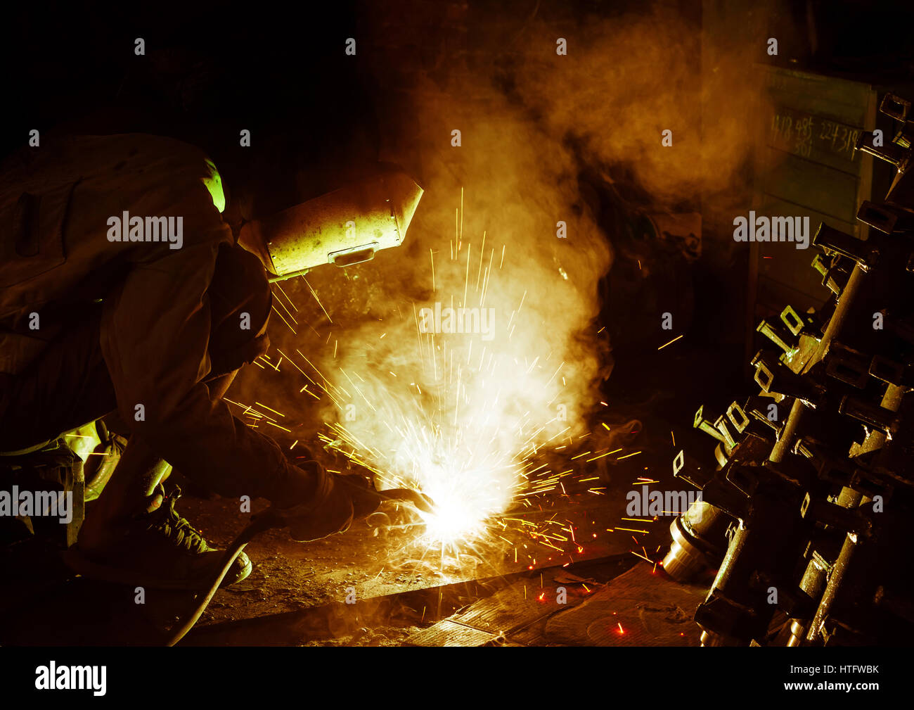 Workers at work, ongoing welding operation Stock Photo - Alamy