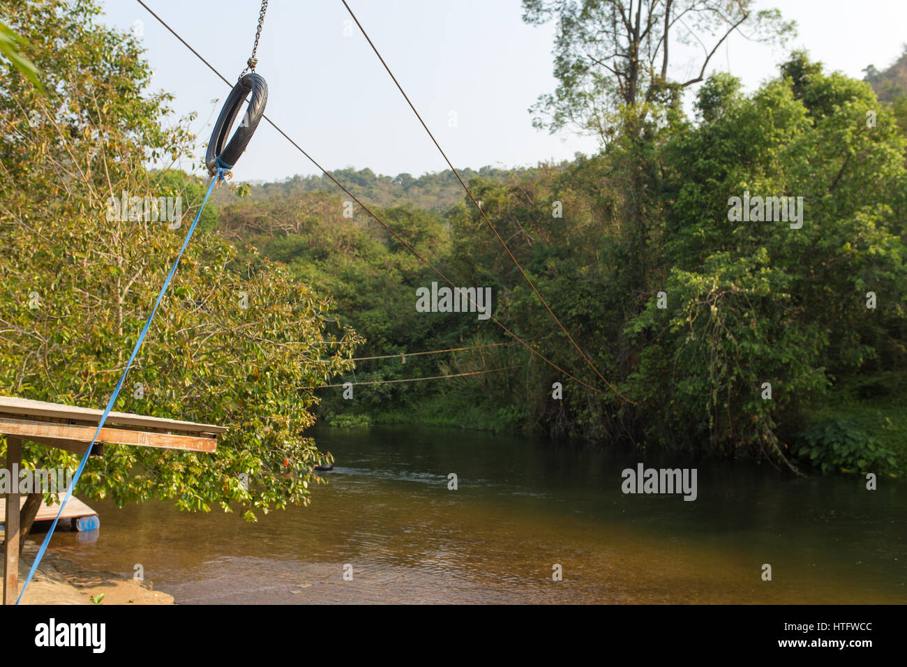 Sliding zip line in an adventure park , Thailand Stock Photo - Alamy