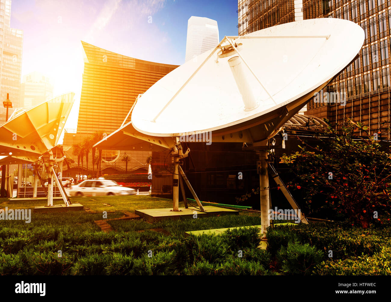 Satellite antenna dusk background Stock Photo - Alamy