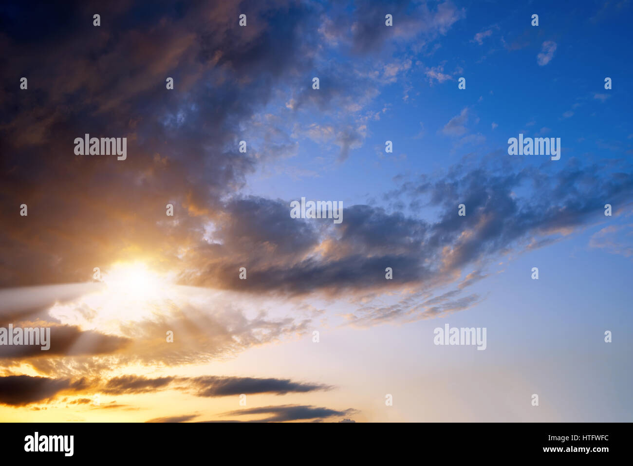 Sunset / sunrise with clouds, light rays and other atmospheric effect ...