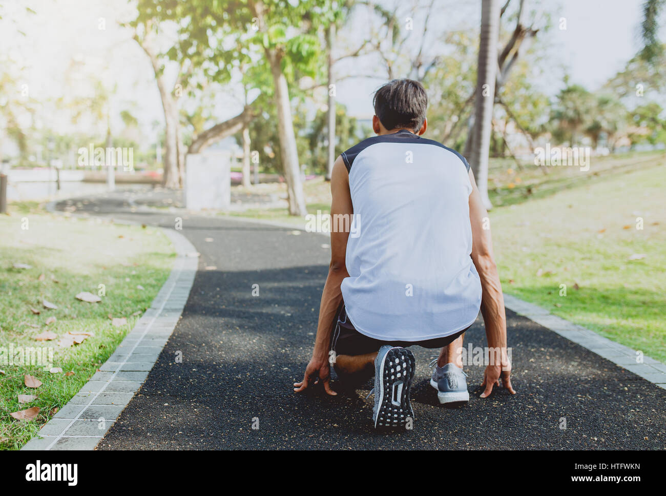 Stadium man sprinter preparing start hi-res stock photography and ...