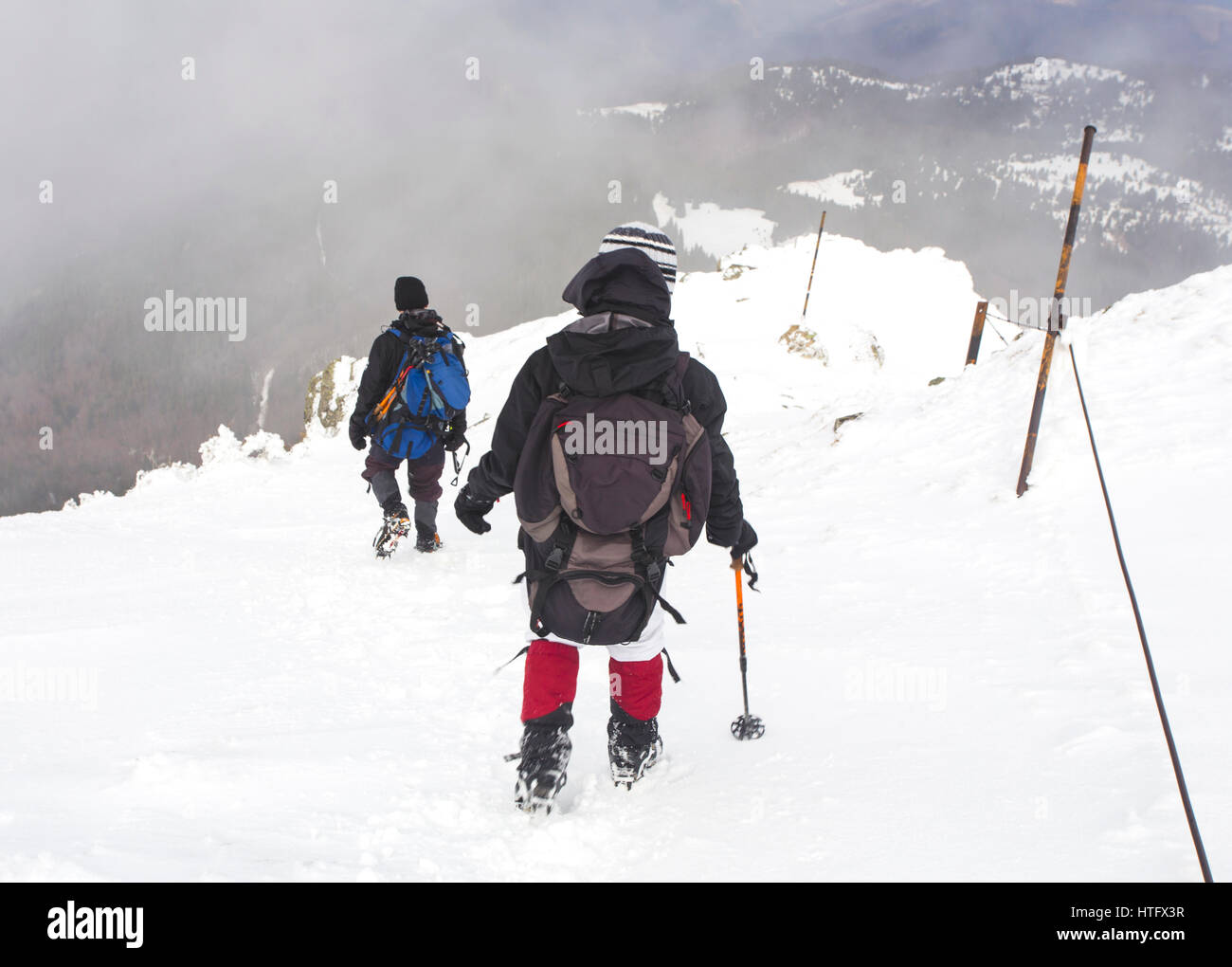 Tourists in a winter mountain Stock Photo - Alamy