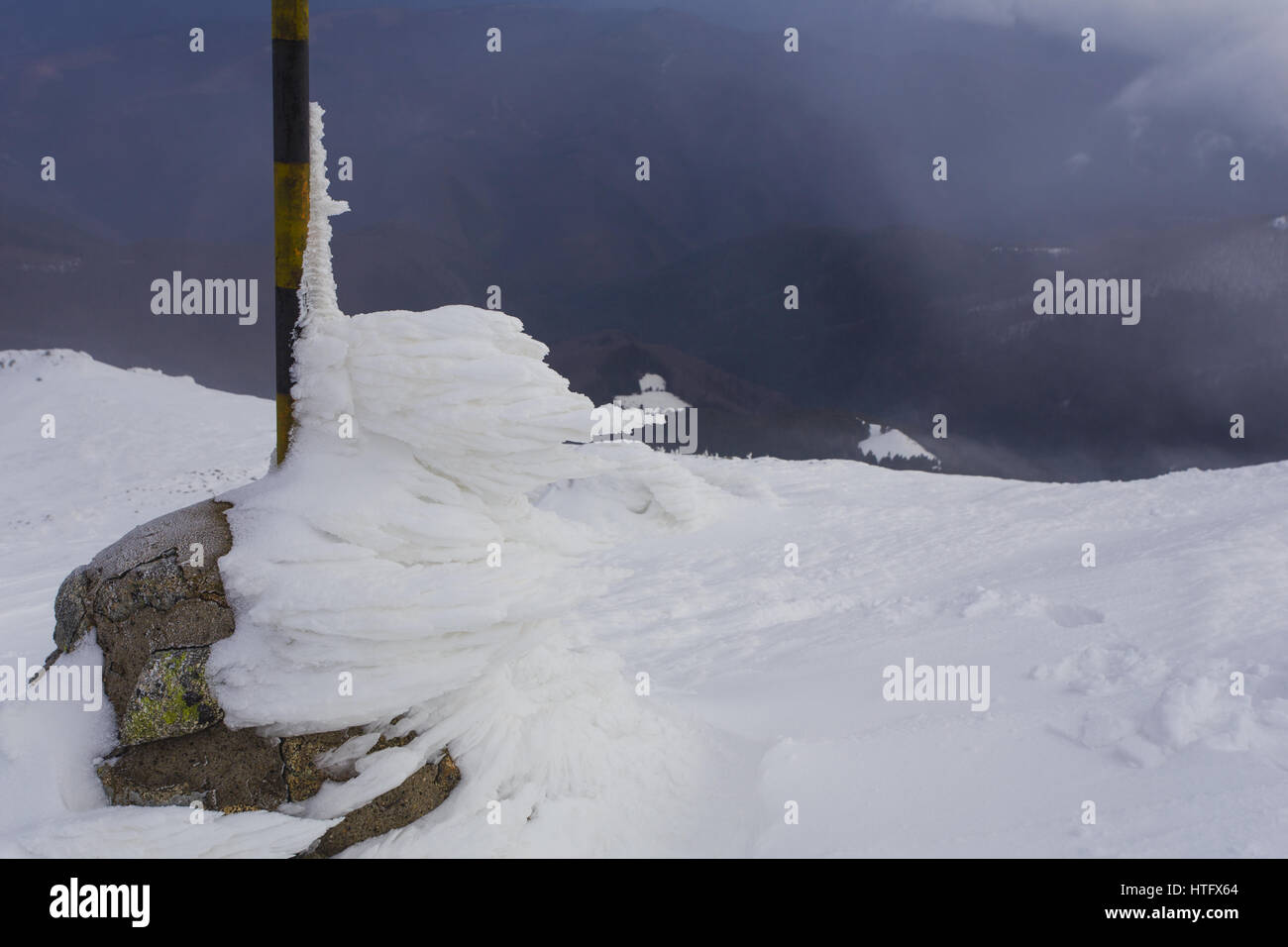 Frozen metal pylon in winter mountain Stock Photo - Alamy
