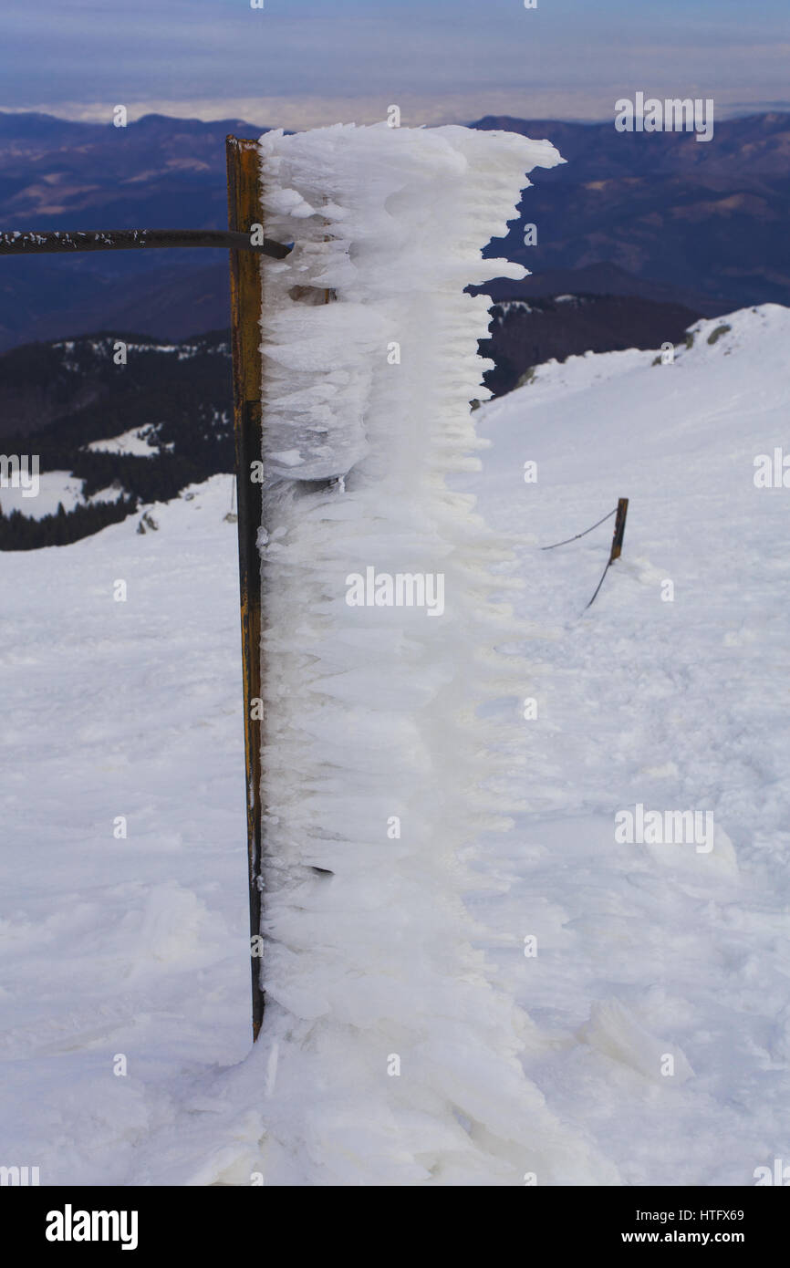 Frozen metal pylon in winter mountain Stock Photo - Alamy