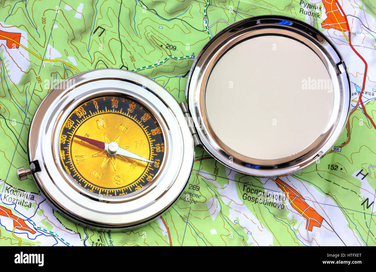 Compass over the map Stock Photo - Alamy