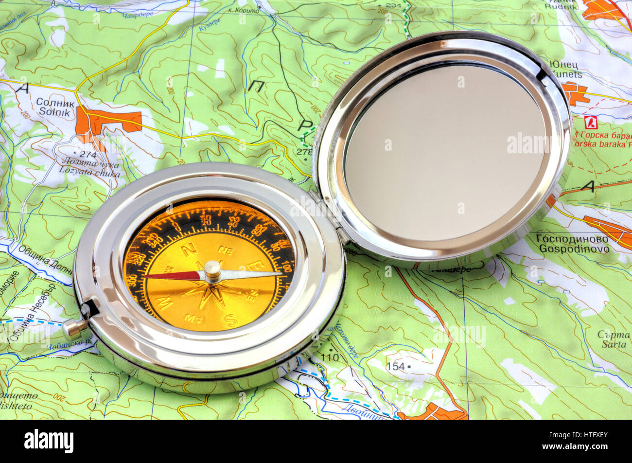 Compass over the map Stock Photo - Alamy