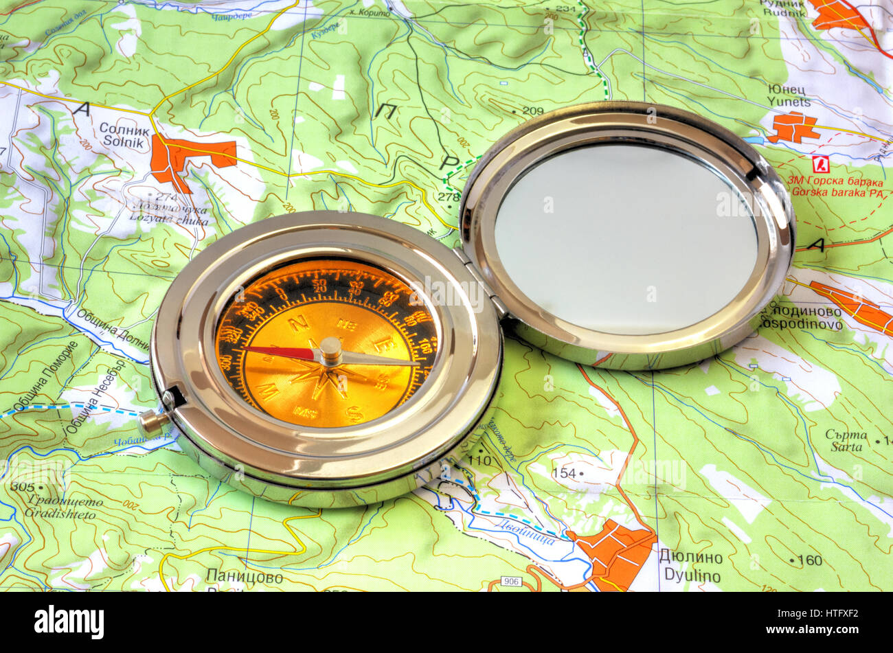 Compass over the map Stock Photo - Alamy
