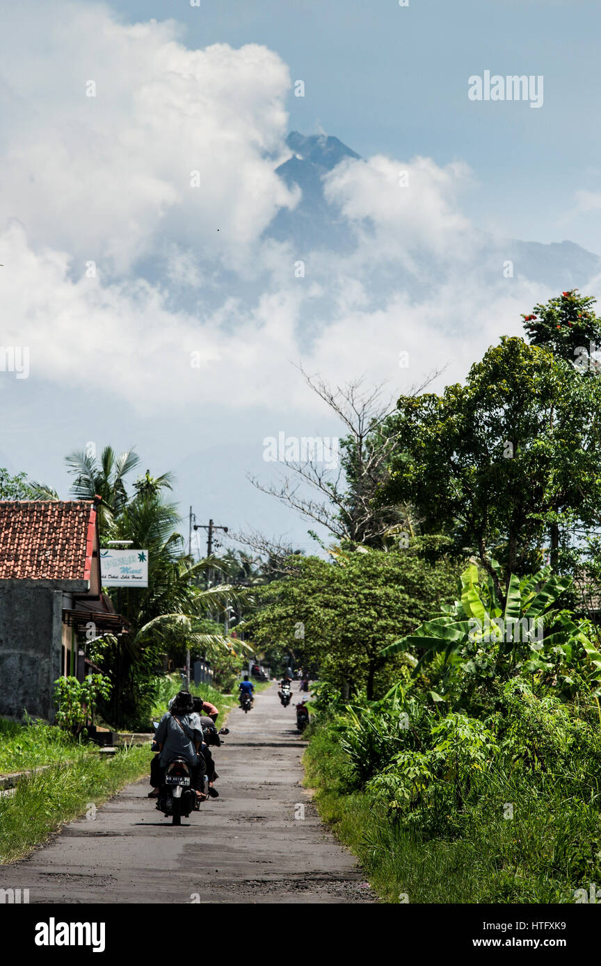 Gunung Merapi volcano towering over a village on the outskirts of ...