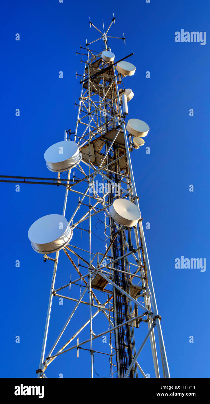Communication antenna tower on blue sky Stock Photo - Alamy