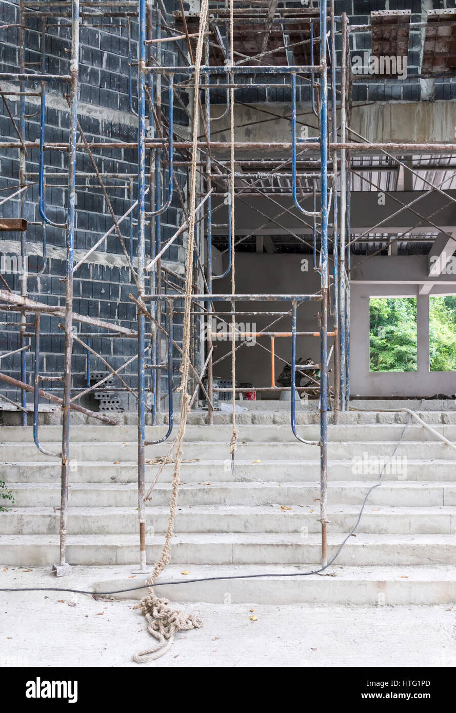 Old metal scaffolding in front of the Unfinished building Stock Photo ...