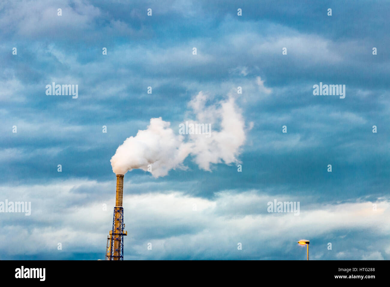 Smoke coming out of a steel smokestack Stock Photo - Alamy