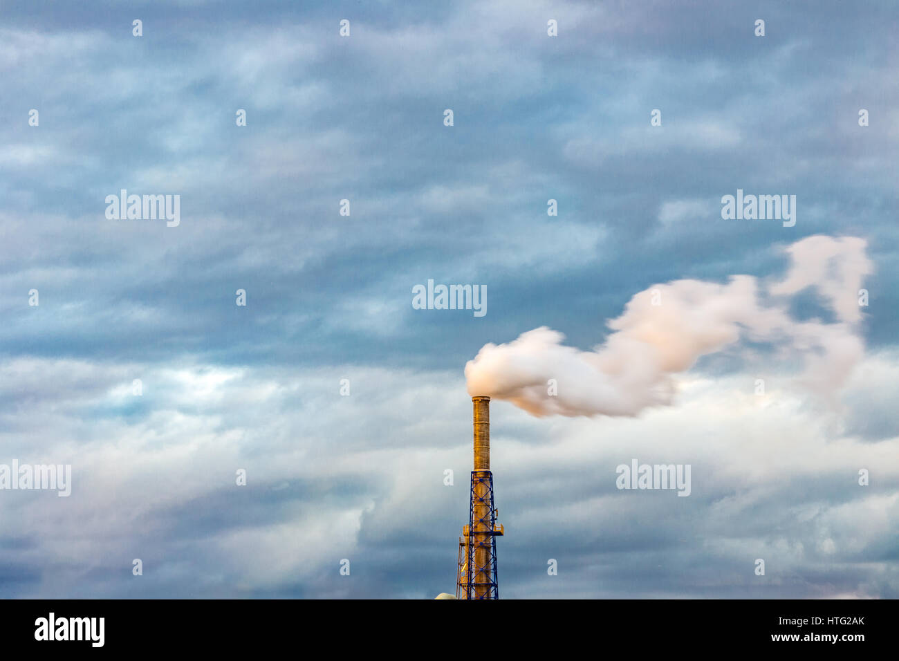 Smoke coming out of a steel smokestack Stock Photo - Alamy