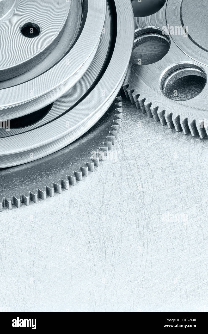 engine gear cogwheels on scratched industrial background closeup view Stock Photo - Alamy