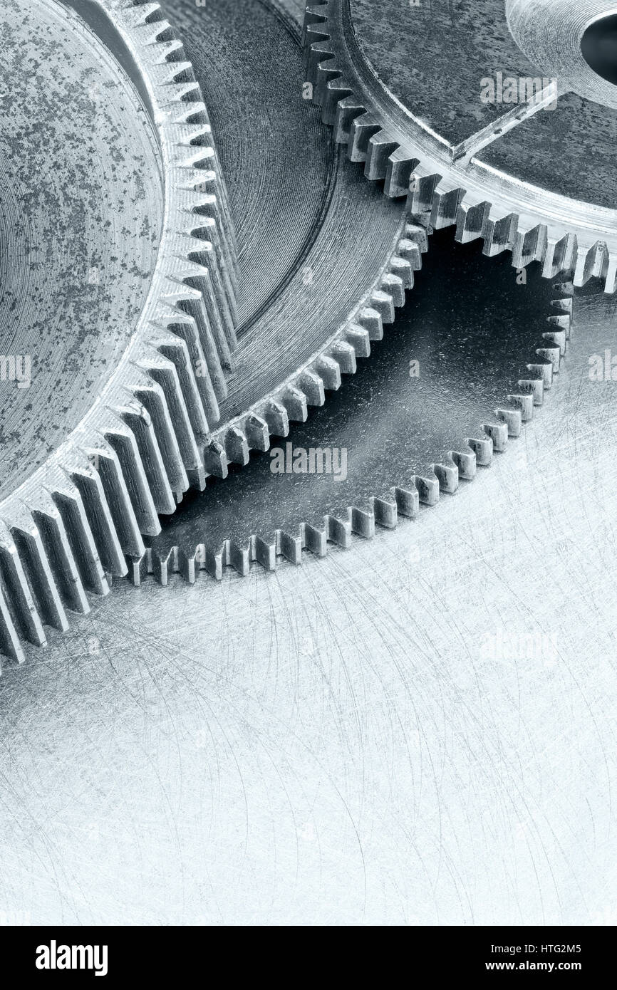 steel grey machinery cogwheels on industrial background macro view ...