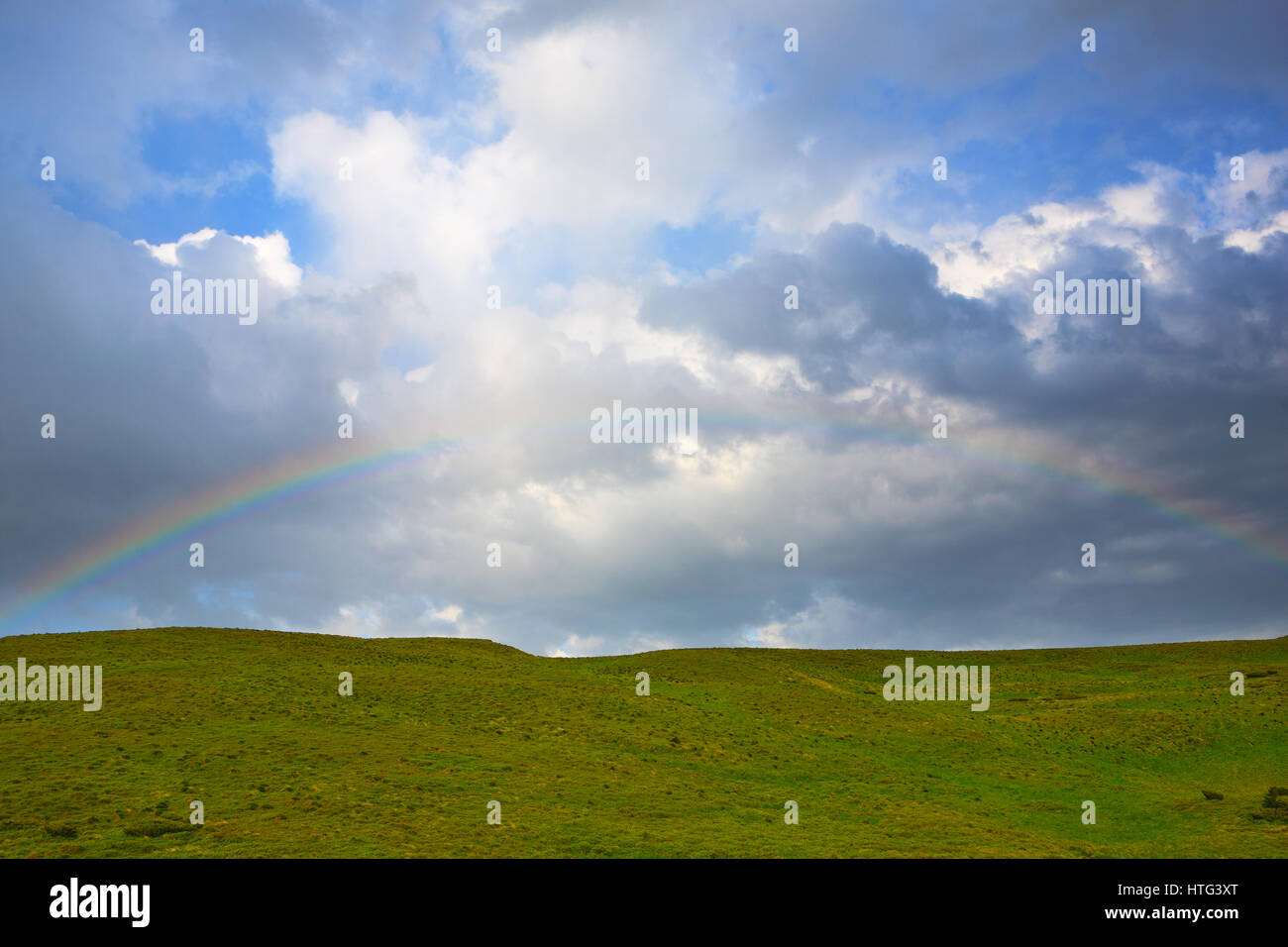 Rainbow in a cloudy sky after the rain Stock Photo - Alamy