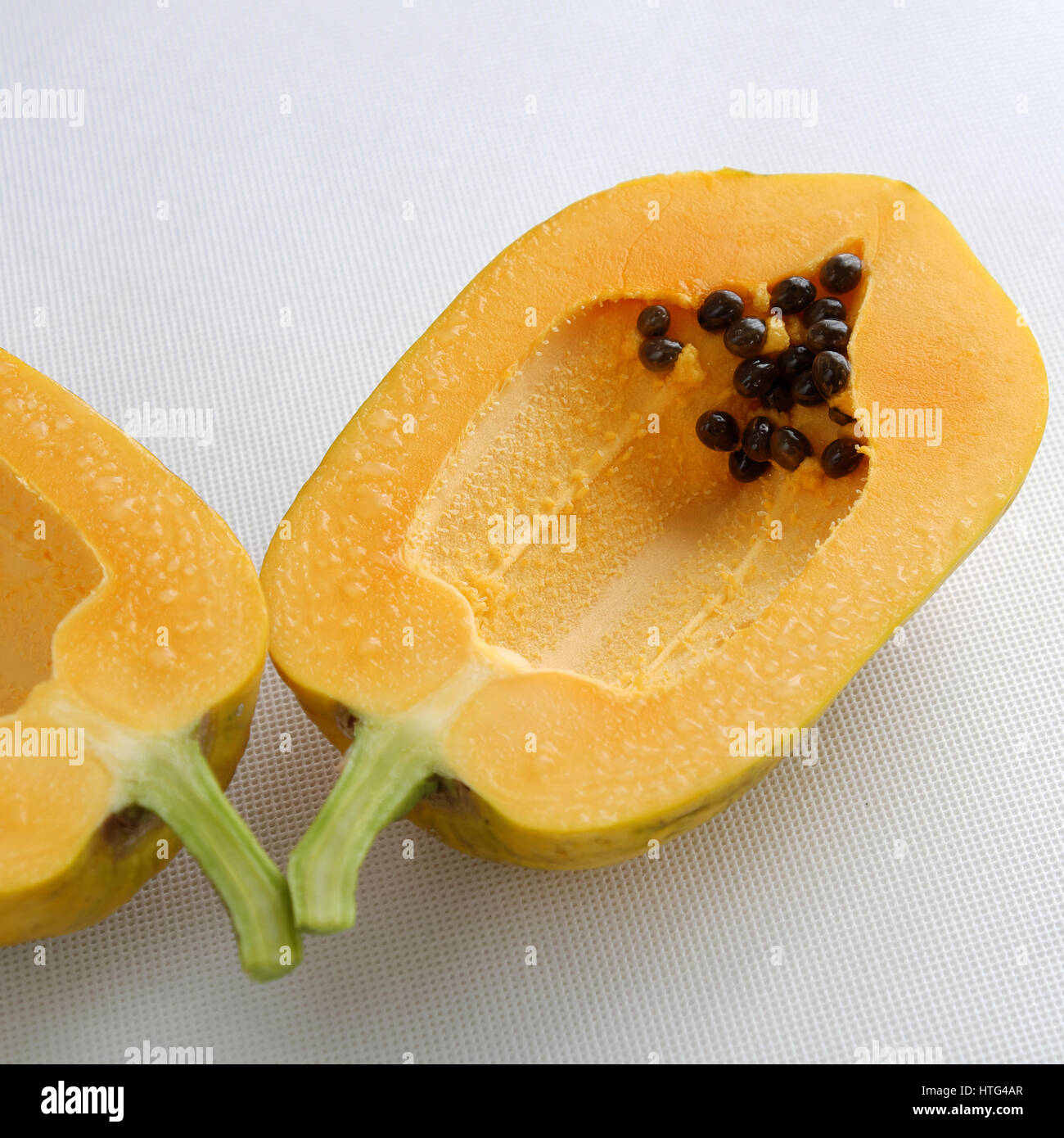 Papaya on white background, tropical fruit, rich fiber, vitamin A,C ,E ...