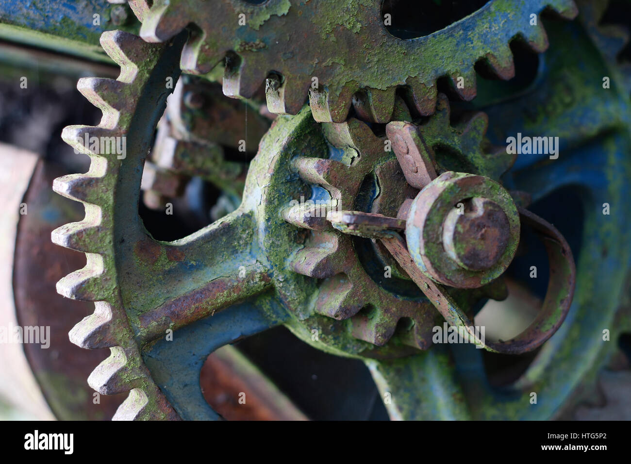 Forgotten, broken mechanism at the dump - gears Stock Photo - Alamy