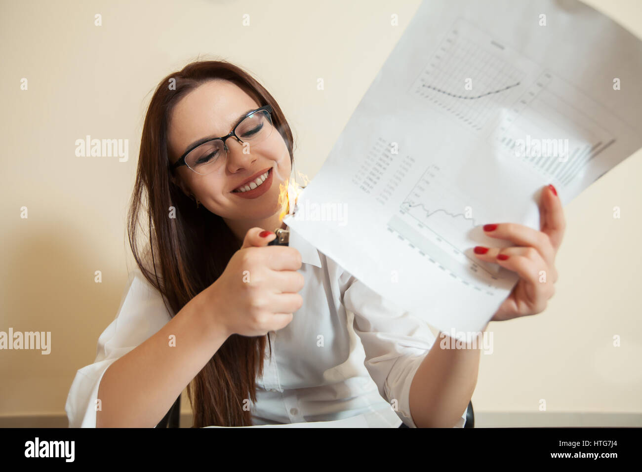 Young female bookkeeper burns accounting documents in office Stock ...