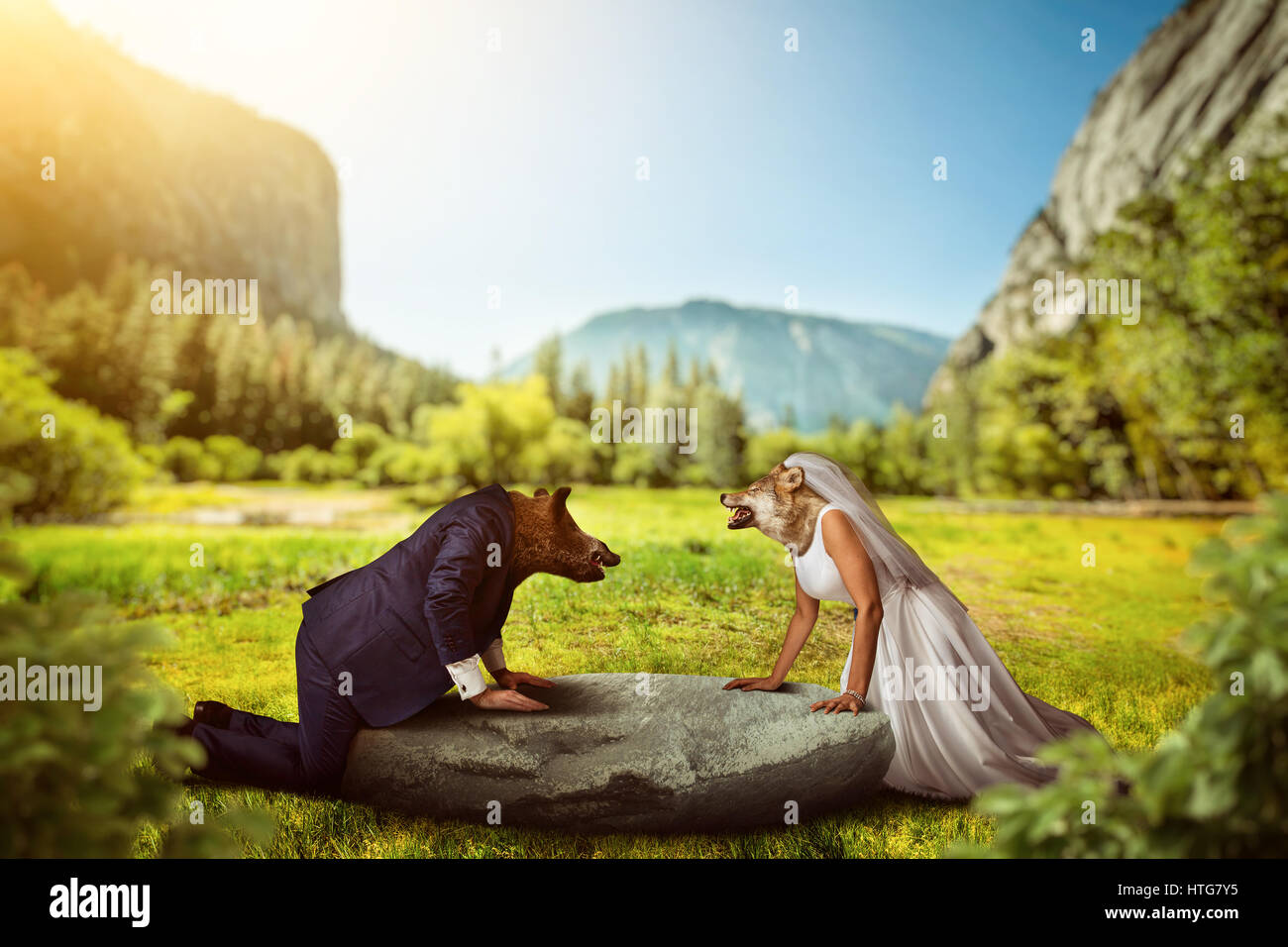 Bride and groom with wild animal heads, mountains and green forest on ...