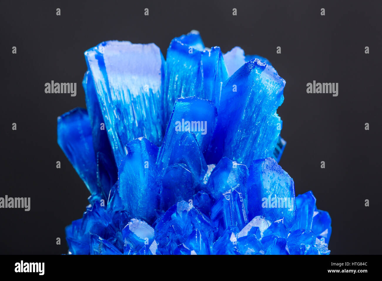 Blue salt crystal isolated on black background. Icy sulphate Stock ...