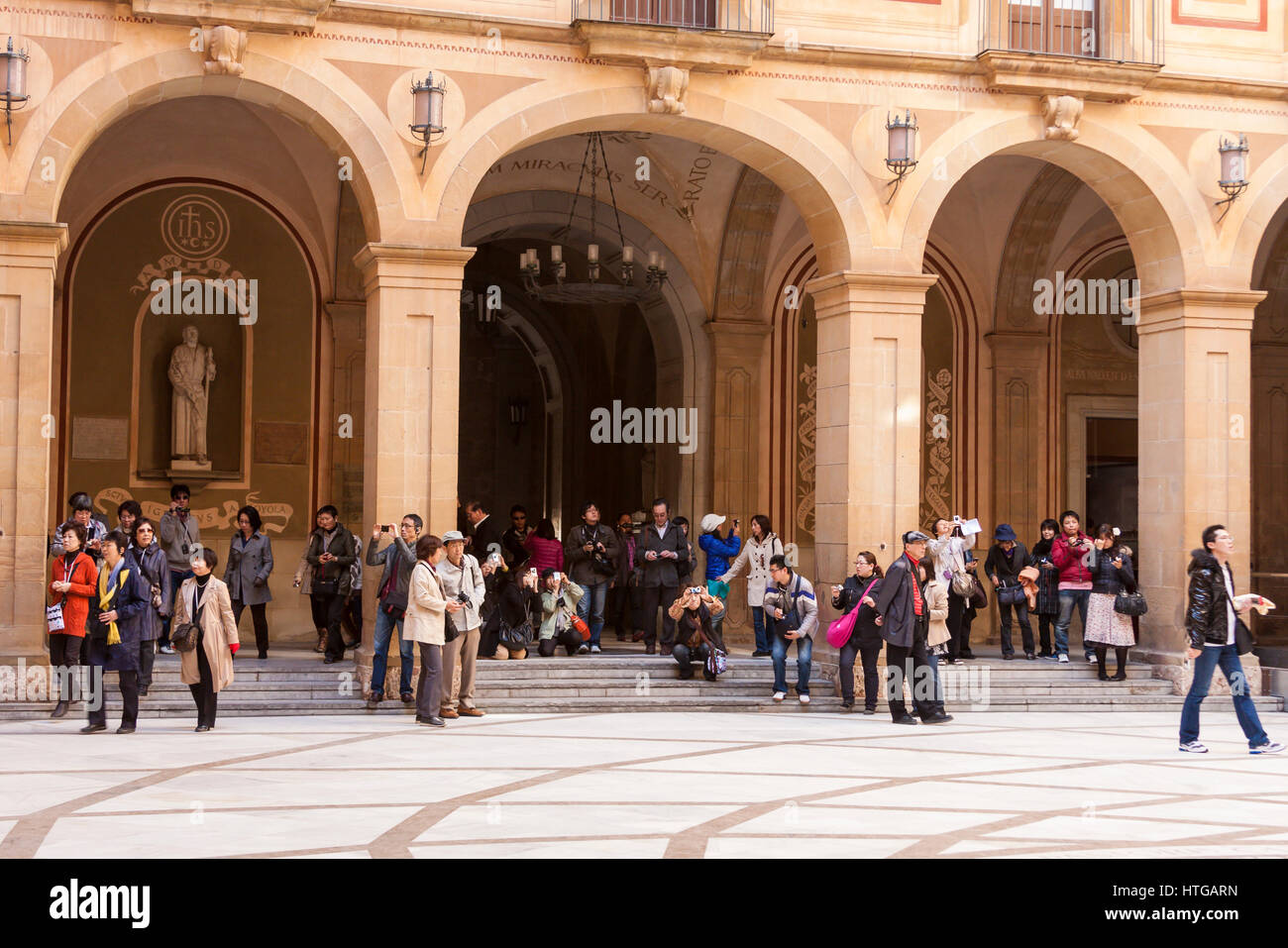 Group of tourists taking photos of and visiting the Basilica of Santa ...