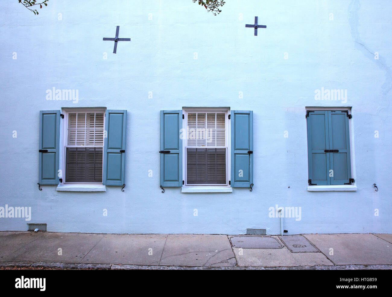 Windows of a blue house in the historic downtown district of Charleston ...