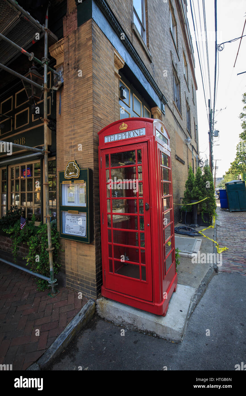 Red telephone box used as a bar advertisement Stock Photo - Alamy