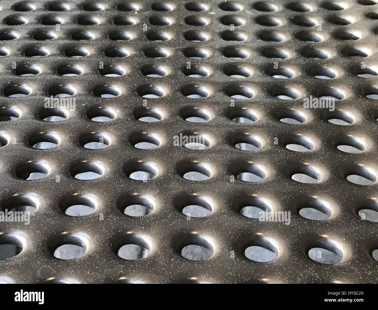 Steel plates with holes for texture. Background Stock Photo - Alamy