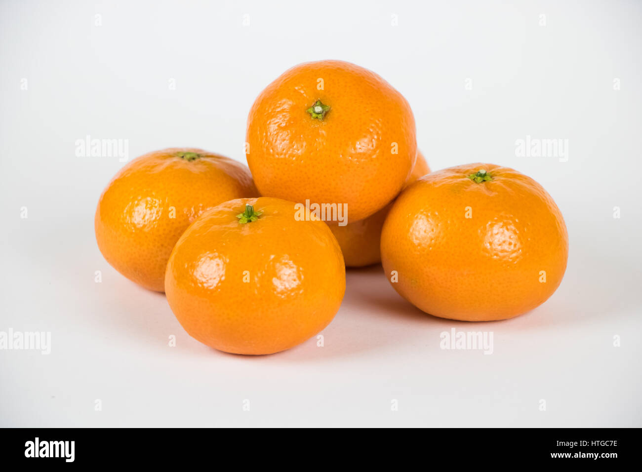 Small Pile of Fresh Ripe Clementines Isolated on White Stock Photo - Alamy