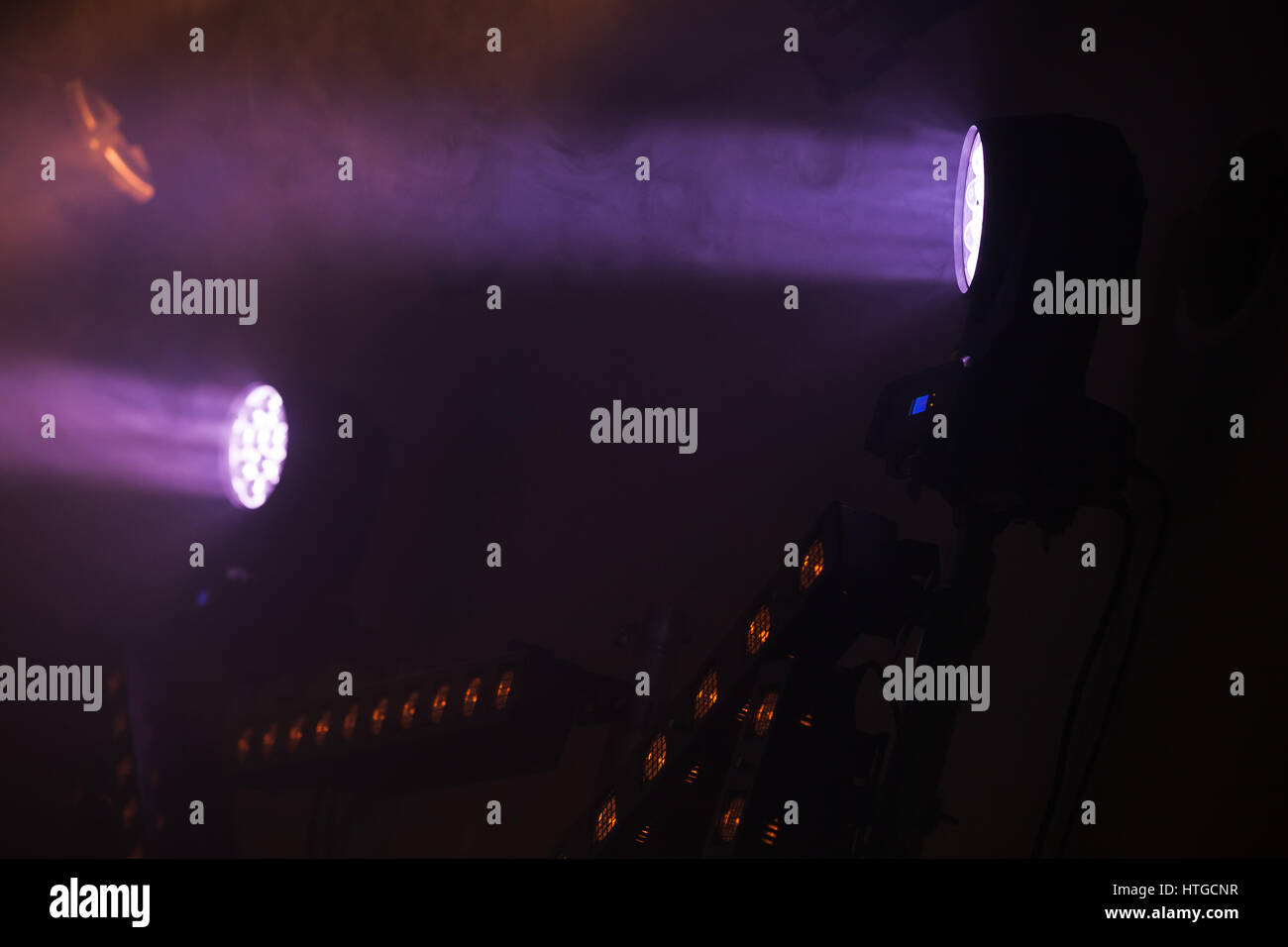 Colorful scenic spot lights with strong beams in the dark, stage ...