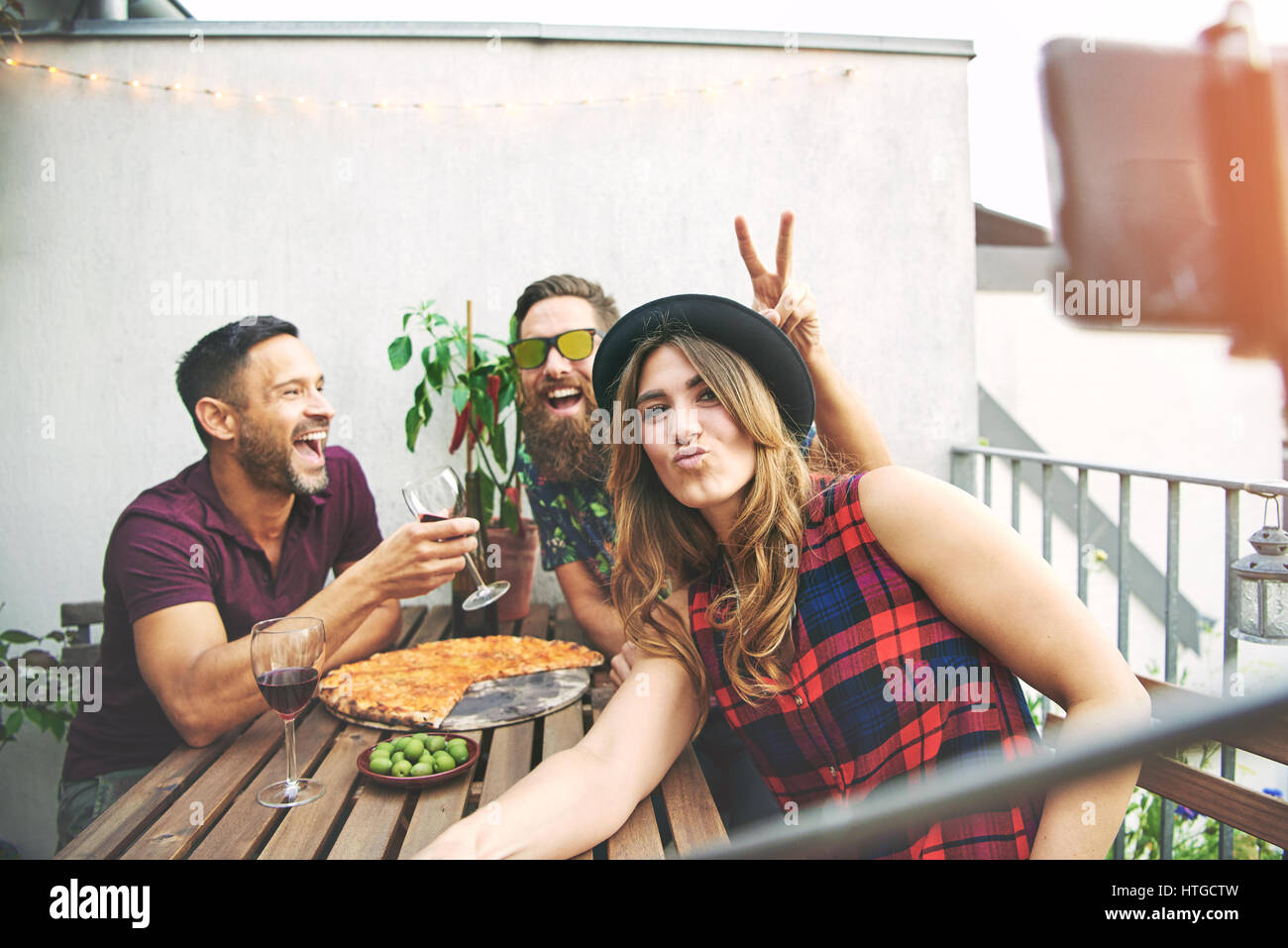 Woman with fingers in ears outside hi-res stock photography and images ...