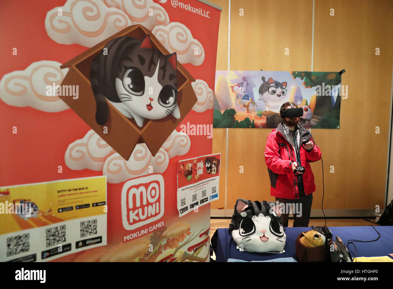 New York, USA. 11th Mar, 2017. A visitor plays a cat-themed game during ...