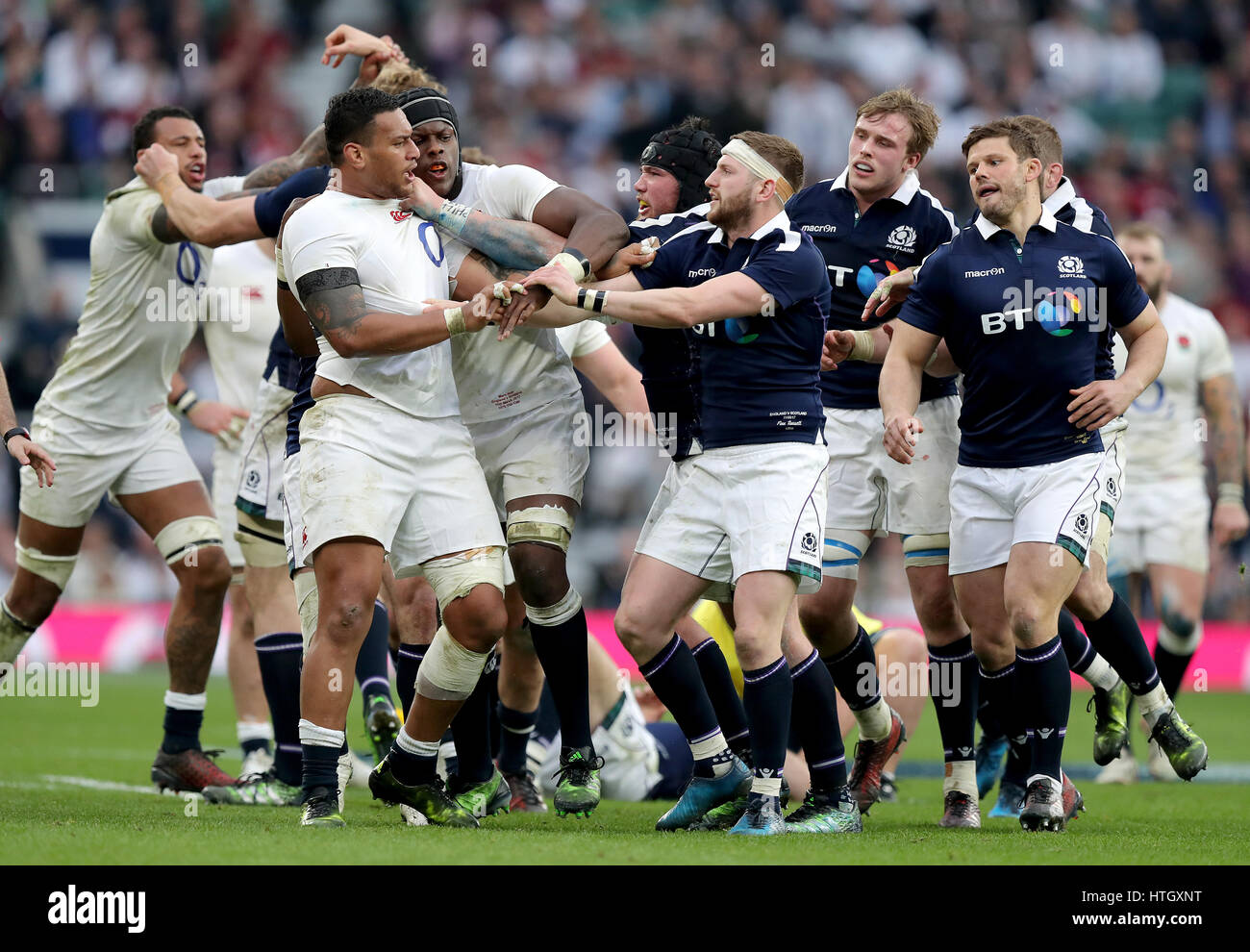 England's Nathan Hughes (left) and Scotland's Finn Russell (centre ...